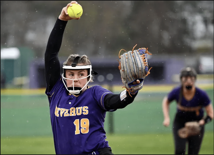 Softball Players Pitching